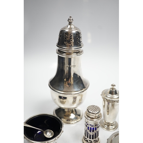 A modern silver baluster sugar caster by Elkington & Co and four ...