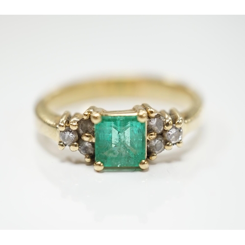 A modern 18k, emerald and diamond set cluster ring, size N, gross ...