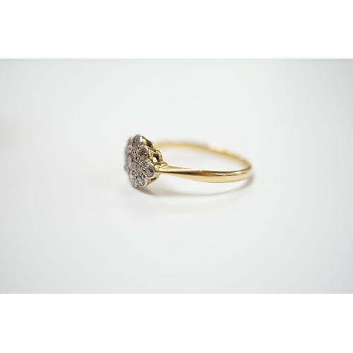 A 1920's 18ct, plat and millegrain set diamond cluster ring, size P ...