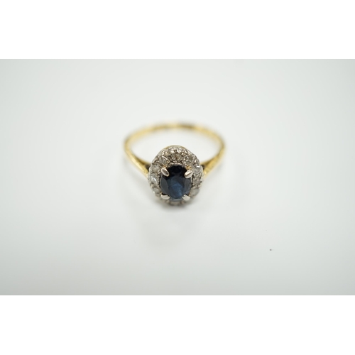 An 18ct, sapphire and diamond set oval cluster ring, size L, gross ...