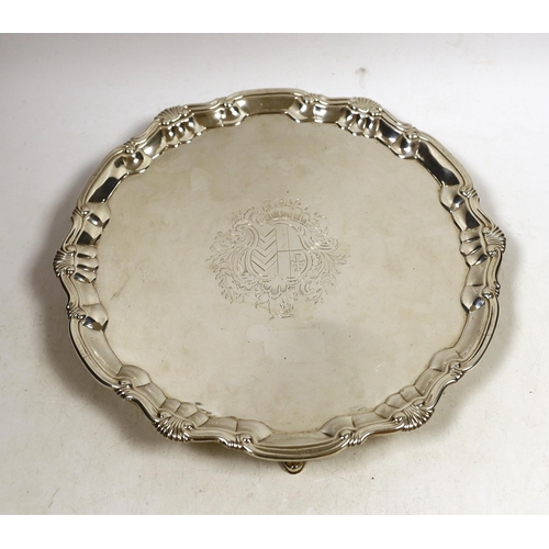 A George II silver salver, of shaped circular form, with shell and ...