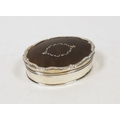 A George V silver and tortoiseshell mounted shaped oval trinket box, by ...