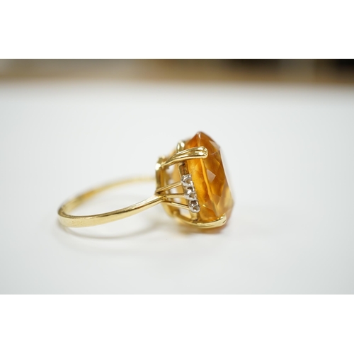 An 18k and single stone oval cut citrine set dress ring, with six stone ...