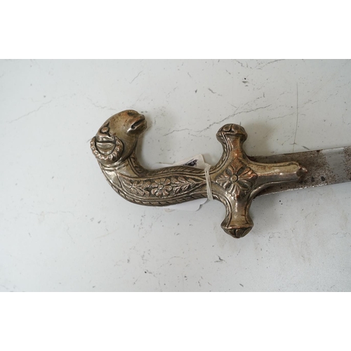 A decorative Indian sword, Shamshir hilt of embossed silver plated ...