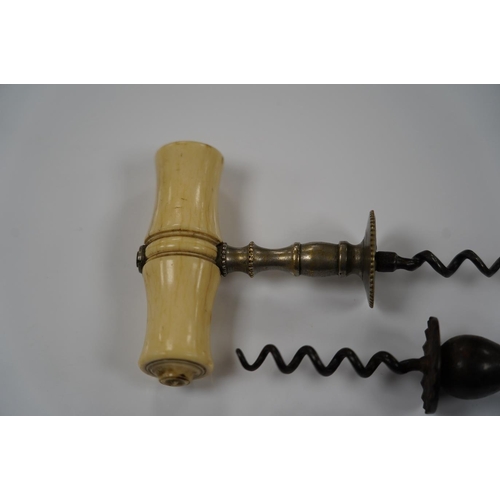 Two early 19th century bone handled corkscrews, one in steel with brush ...