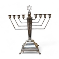 A modern silver Hanukkah Menorah, on a square base with four claw and ...