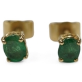 A pair of 9ct and solitaire oval cut emerald set ear studs, gross ...