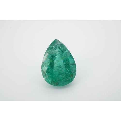 An unmounted pear cut emerald, weighing 6.32ct. Condition - poor to fair