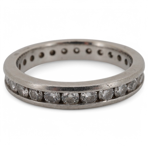 A diamond eternity ring, channel-set with a continuous band of ...