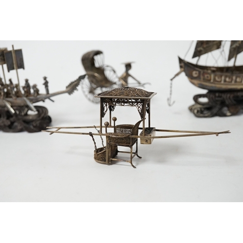 A Chinese white metal miniature model of a junk, length 11.2cm, on a ...