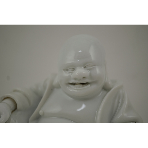 A Chinese blanc-de-chine seated figure of Budai, 18th/19th century, the ...