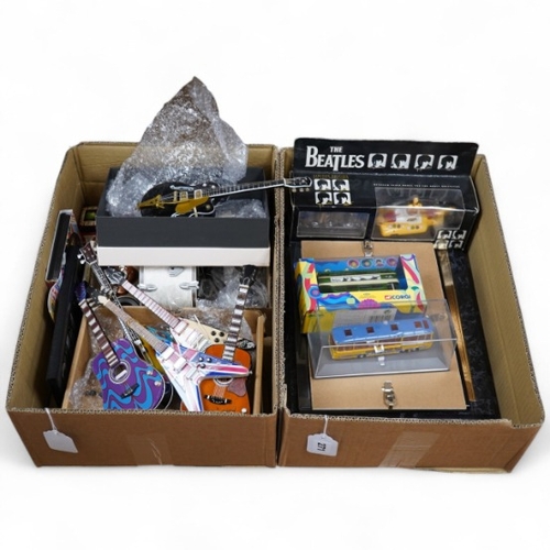 A collection of Beatles memorabilia including; models of a Beatles drum ...