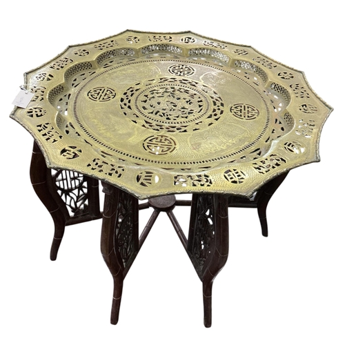 A Chinese pierced brass tray top table on hardwood folding stand, width ...