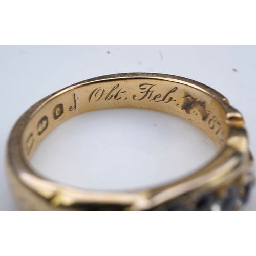 A Victorian enamel and diamond mourning ring, circa 1872, of foliate ...