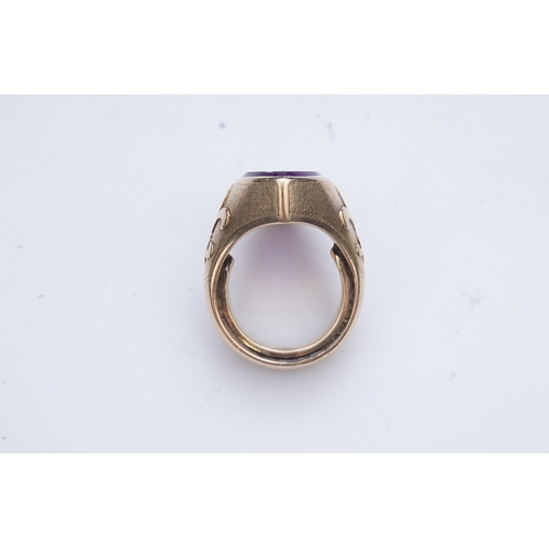 A gold and amethyst episcopal ring, early 20th century, set with a ...
