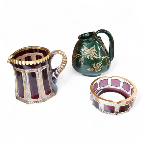 Three pieces of Bohemian and Austrian glassware comprising two jugs and ...