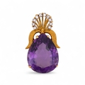 An Amethyst and diamond pendant, claw-set with a pear-shaped amethyst ...