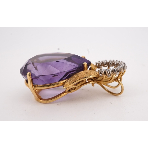 An Amethyst and diamond pendant, claw-set with a pear-shaped amethyst ...