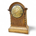 A 19th century French walnut bracket clock, the engraved brass dial ...