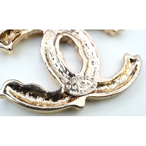 Chanel, a 'Coco Mark' brooch, designed as the crossed 'C' monogram for ...