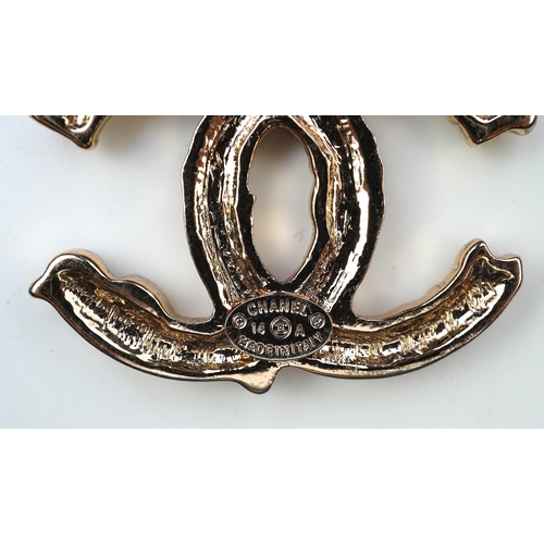 Chanel, a 'Coco Mark' brooch, designed as the crossed 'C' monogram for ...