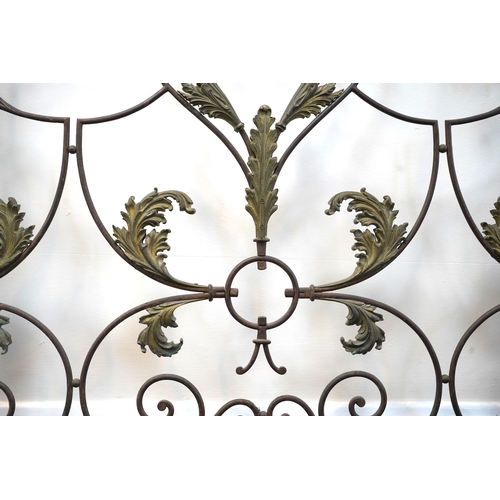 A pair of French wrought iron gates, c.1900, decorated with sinuous ...