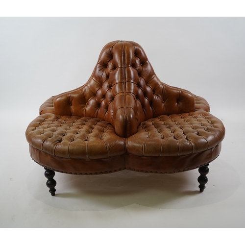 A contemporary Victorian style buttoned tan leather conversation seat ...