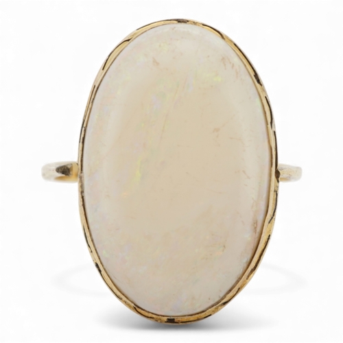 An opal ring, collet-set with an oval opal cabochon measuring ...