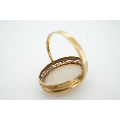An opal ring, collet-set with an oval opal cabochon measuring ...