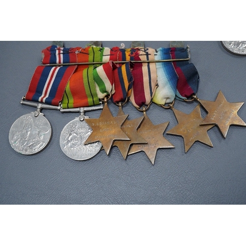 Three WWII medal groups (15 medals in total);a seven medal group ...