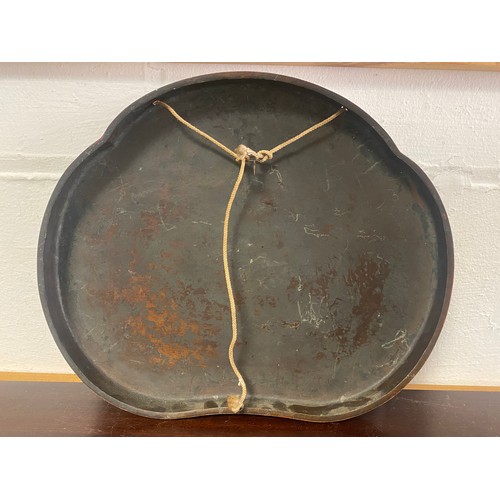 A Chinese enamelled bronze gong of cloud shape and decorated with ...