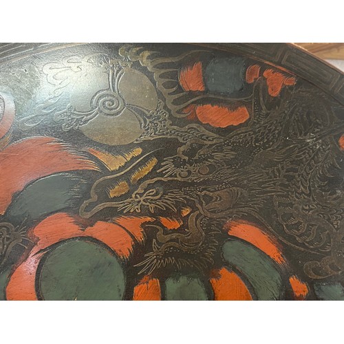 A Chinese enamelled bronze gong of cloud shape and decorated with ...