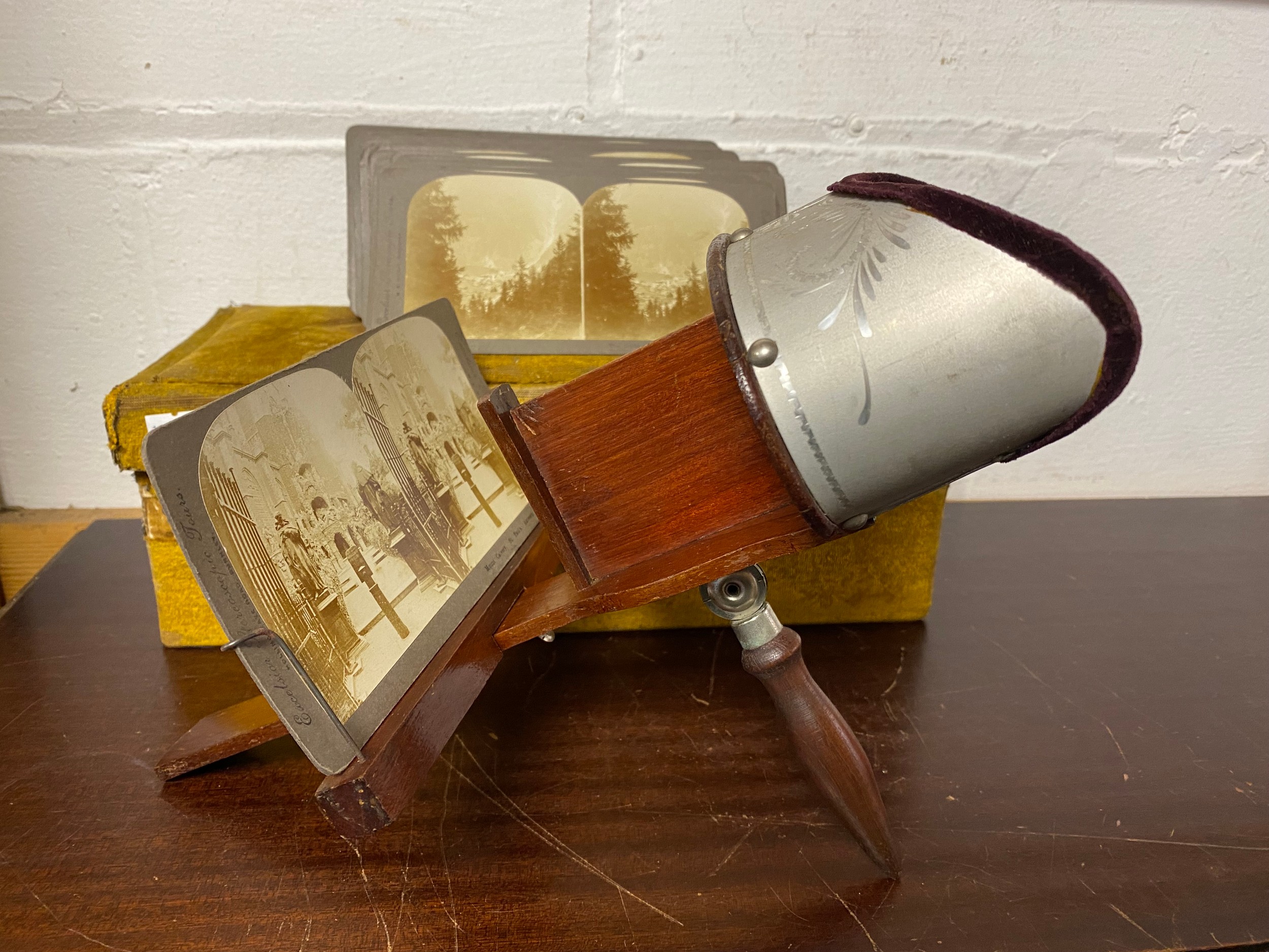 A late 19th century stereoscopic viewer, together with approximately 50 ...