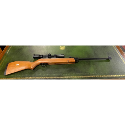 A Webley Vulcan .22 break barrel air rifle with scope and case