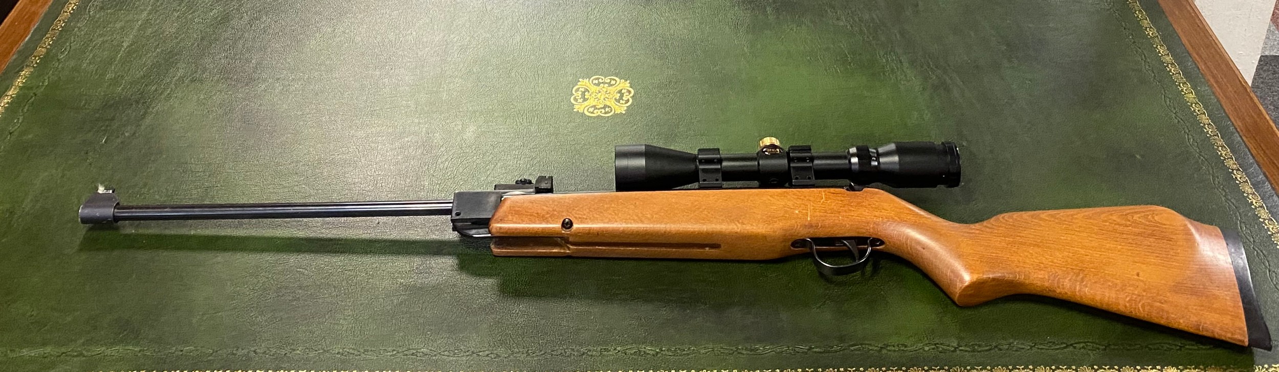 A Webley Vulcan .22 break barrel air rifle with scope and case