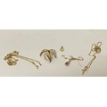 A 9ct gold brooch, of leaf design, together with a ruby pendant on ...