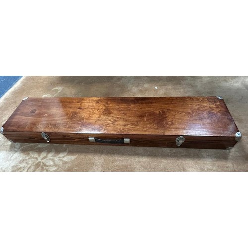 A metal mounted wooden gun case, re-lined and refurbished