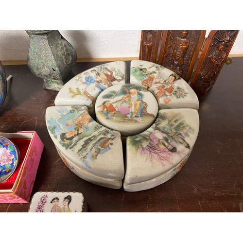 A set of Chinese boxes, each cover with figural decoration, together ...