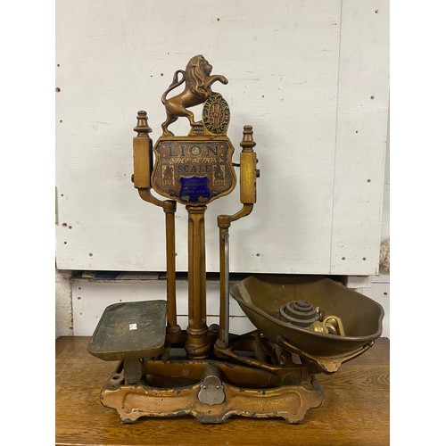 A set of counter top Lion scales