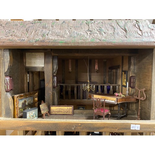 A Robert Stubbs 'Radnor Hall' dolls house, designed as a three storey ...