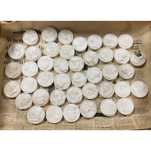 A quantity of Grand Tour style plaster cast intaglios