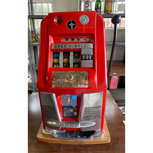 A Sega Bell one armed bandit machine table top fruit machine