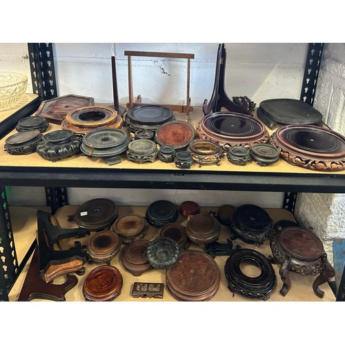 A quantity of Chinese carved stands