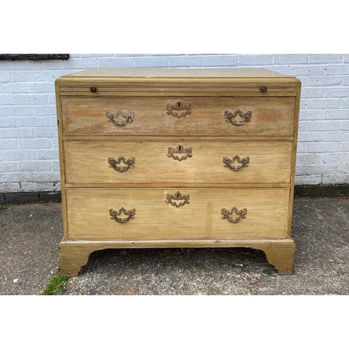 A 19th Century bachelors chest, with brushing slide over three long ...