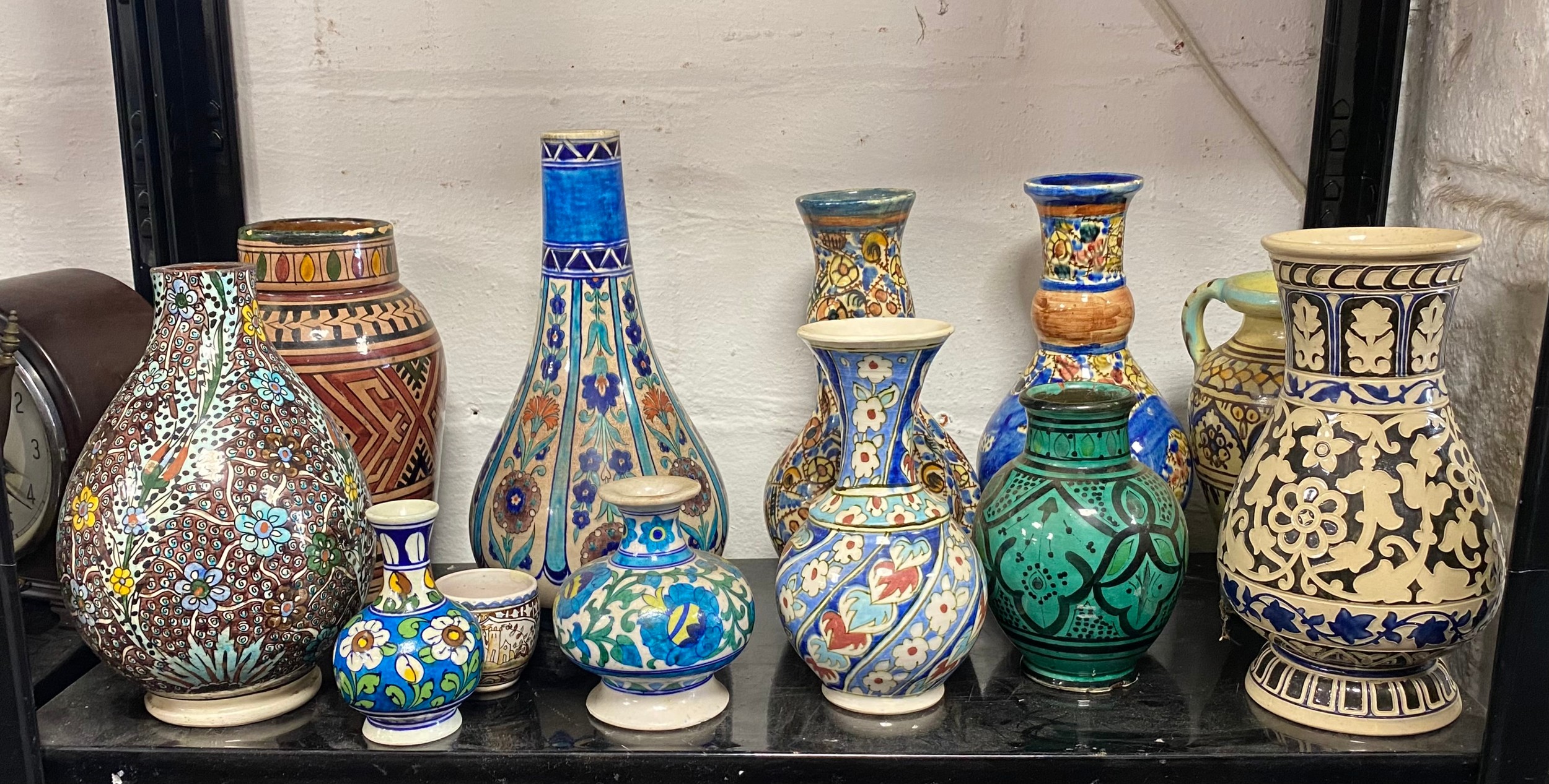 A Middle Eastern vase and other pottery