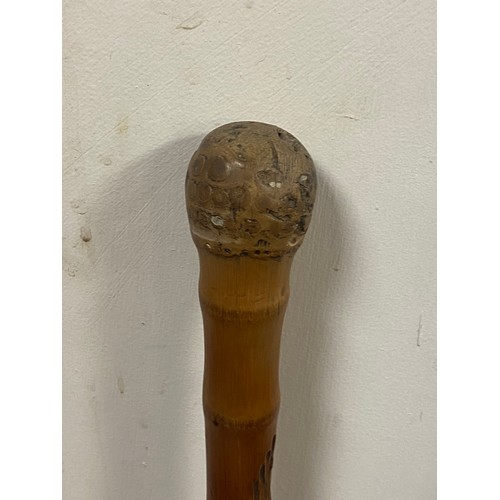 A Japanese carved walking stick