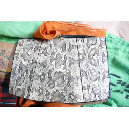 A collection of vintage lizard & faux lizard skin handbags ...