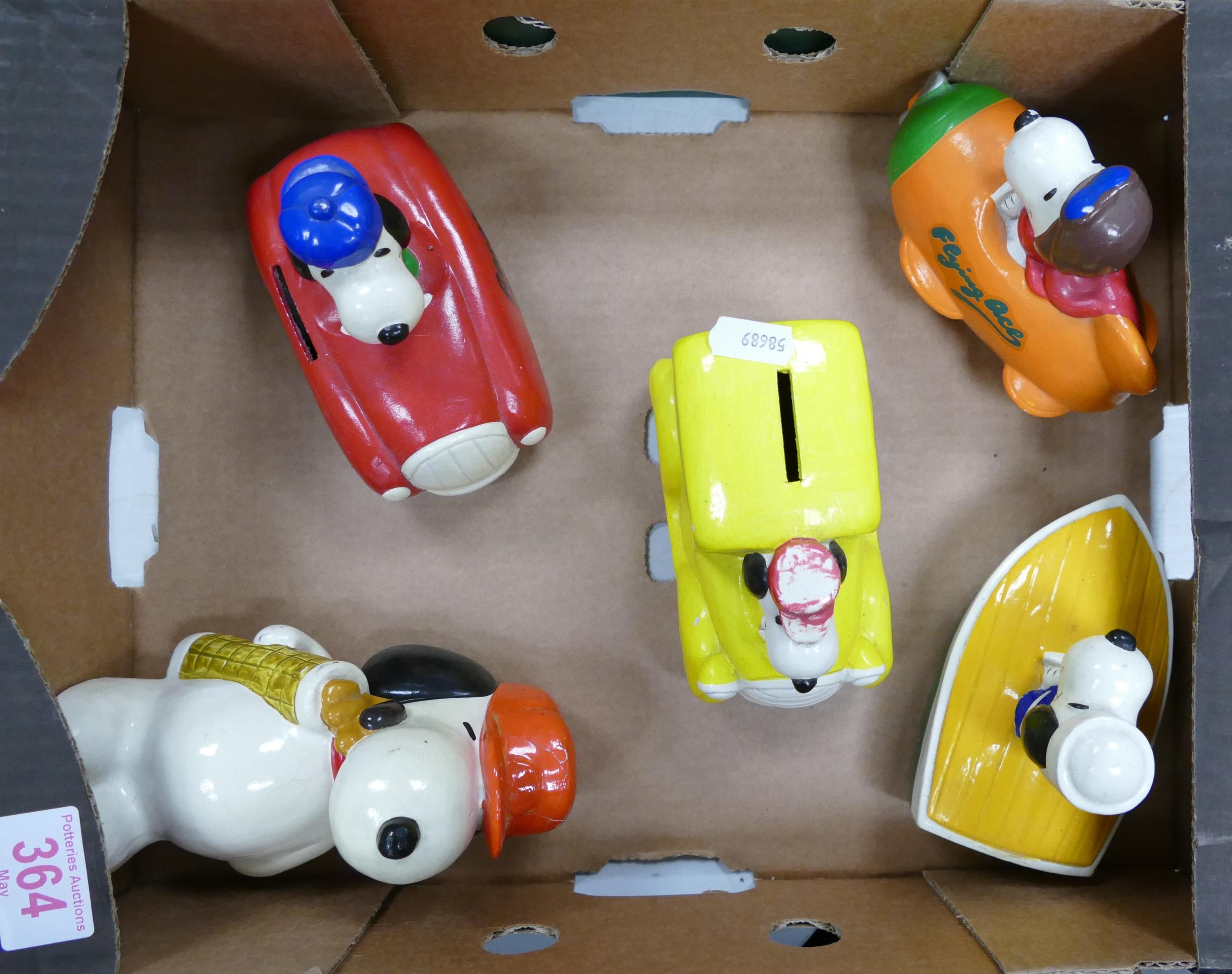 Five vintage Snoopy money boxes with stoppers