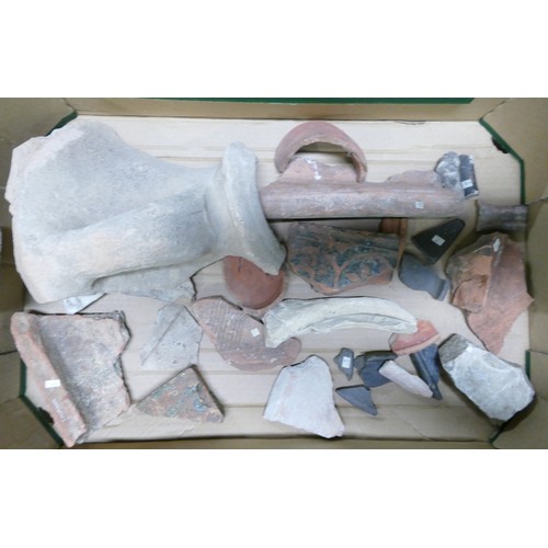 A collection of ancient pottery fragments and shards including part of ...
