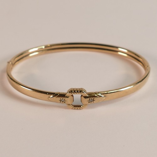 9ct Gold buckle Diamond bangle, 8.4g.
